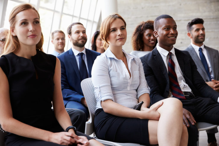 Audience Listening To Speaker At Business Conference Periolinks